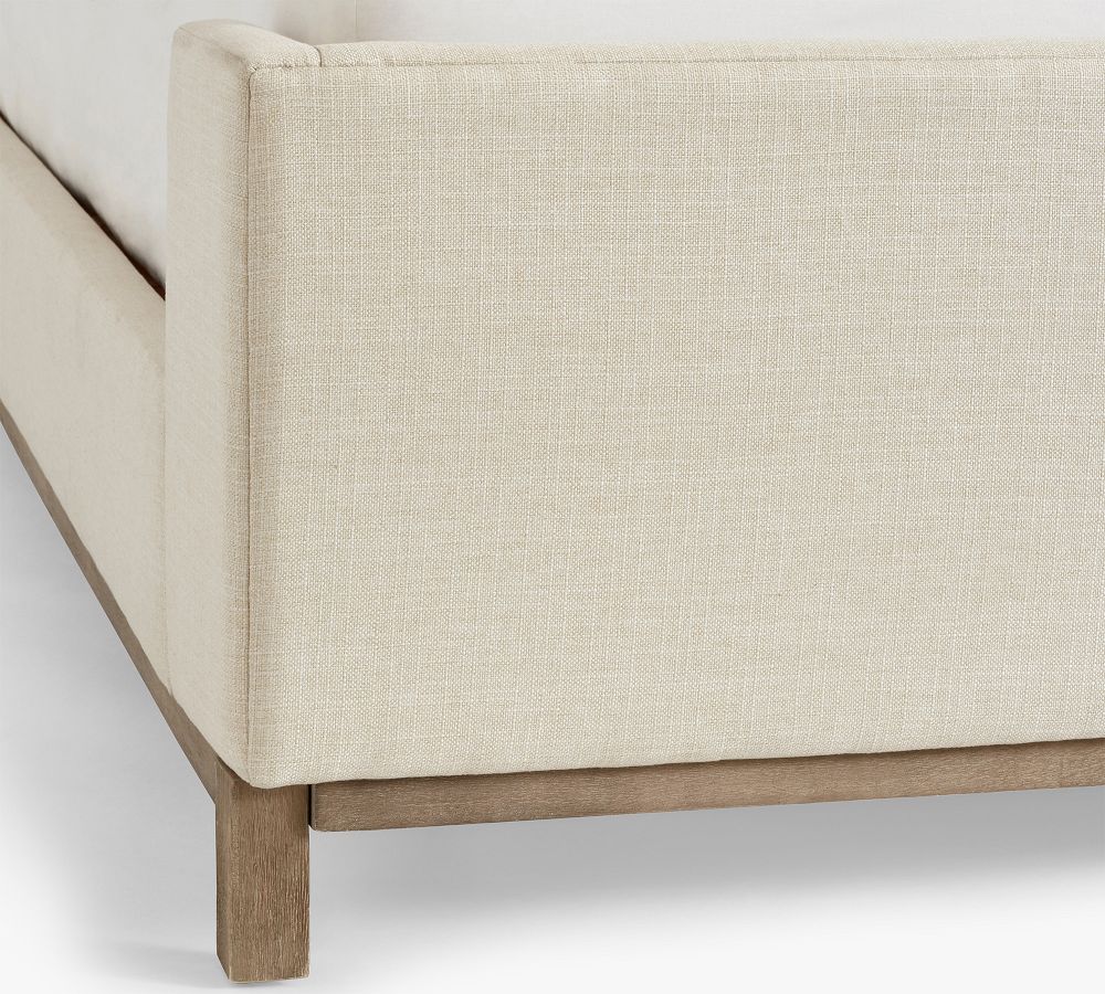 Jake Upholstered Platform Sleigh Bed with Wood Base | Pottery Barn