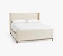 Jake Upholstered Platform Sleigh Bed with Wood Base | Pottery Barn