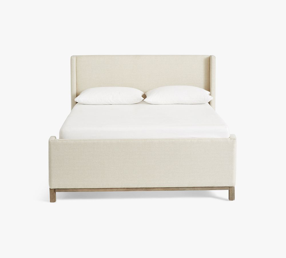 Jake Upholstered Platform Sleigh Bed with Wood Base | Pottery Barn
